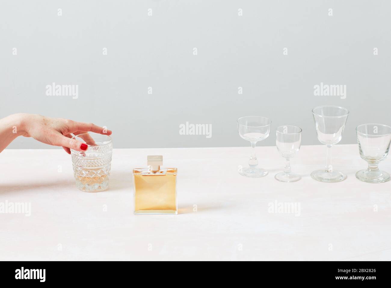 Red nails, perfume, whiskey, glasses Stock Photo - Alamy