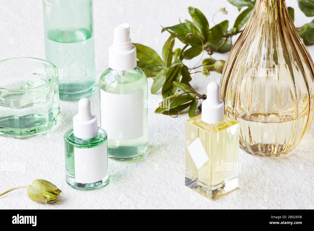 Collection of bath oil products and glassware Stock Photo - Alamy