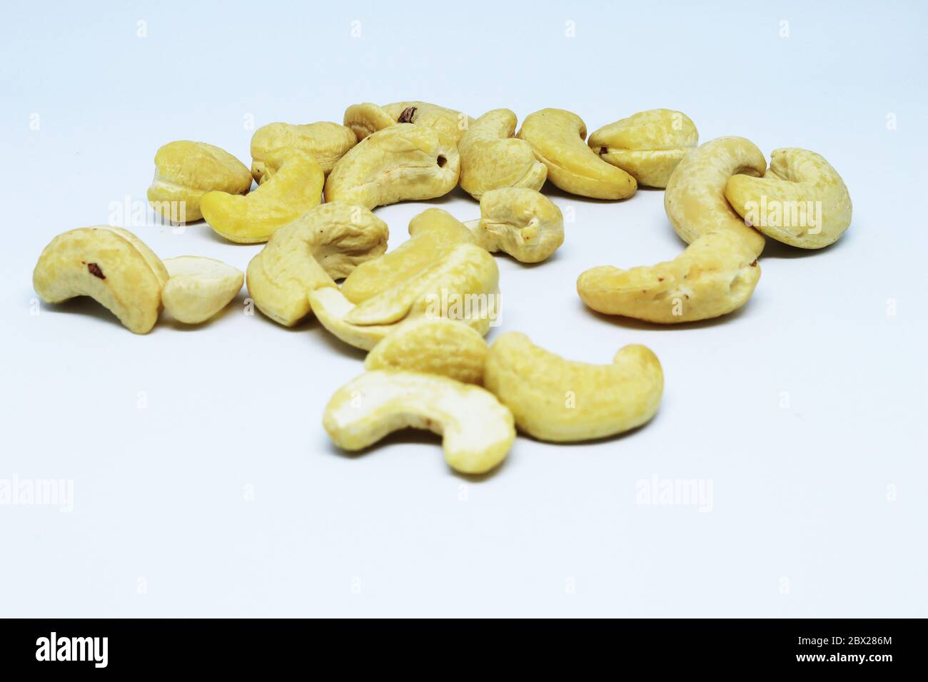 Organic Cashew nuts close-up isolated on white background Stock Photo ...