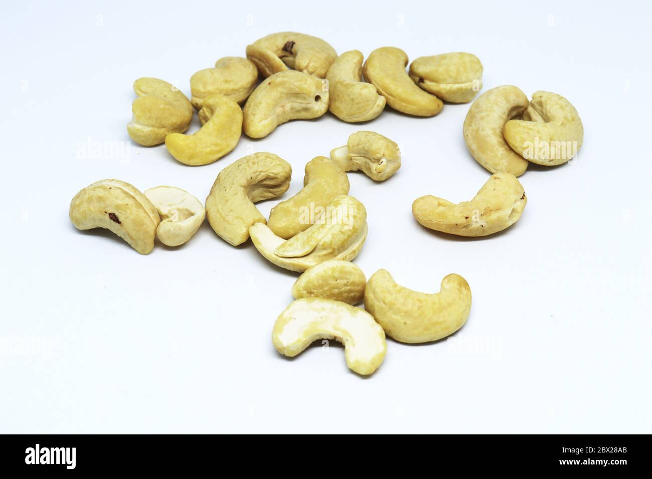 Organic Cashew nuts close-up isolated on white background Stock Photo ...