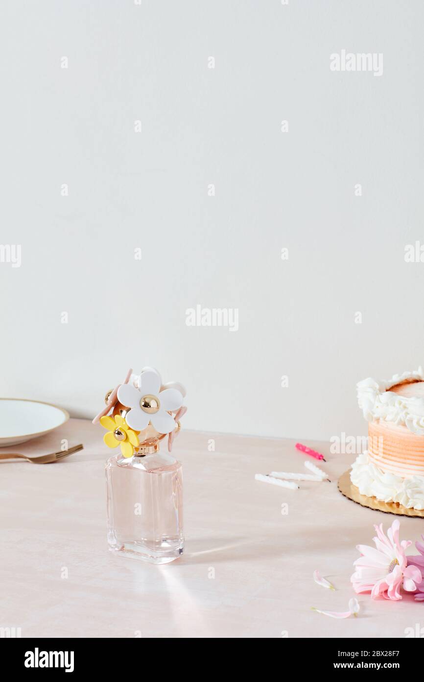 Perfume bottle and birthday cake Stock Photo - Alamy
