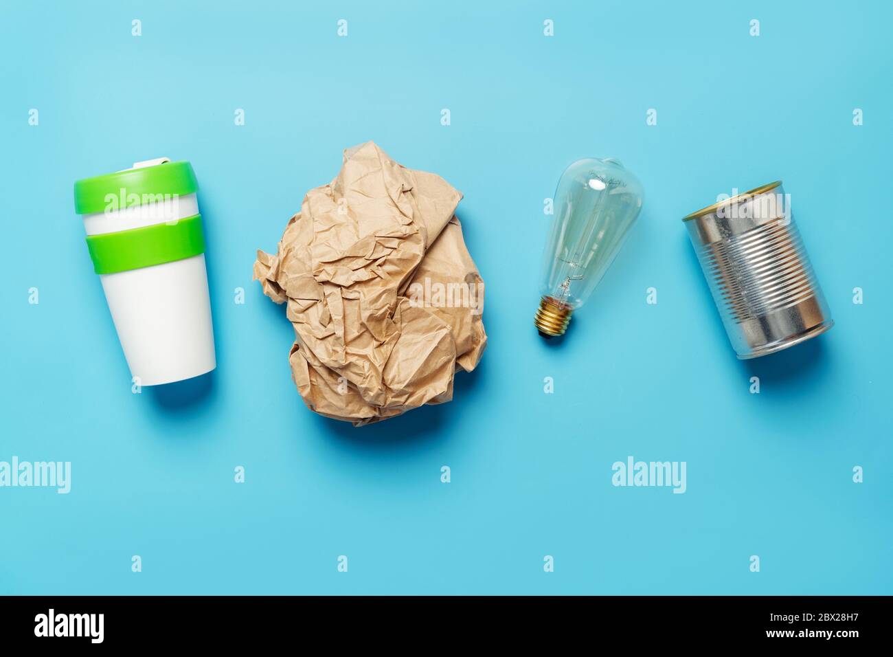 Recycling garbage. Objects, plastic, metal, paper, glass on a blue ...