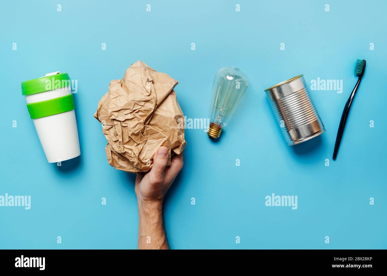 Recycling and reusing resources. Ecological concept. Items on a blue ...