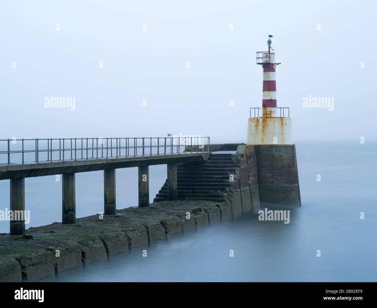 Amble pier in mist hi-res stock photography and images - Alamy