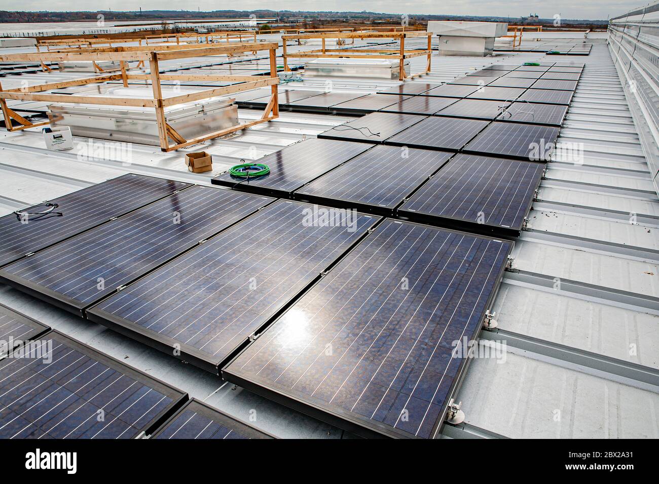 Commercial Solar Panel Installation on Roof Stock Photo - Alamy