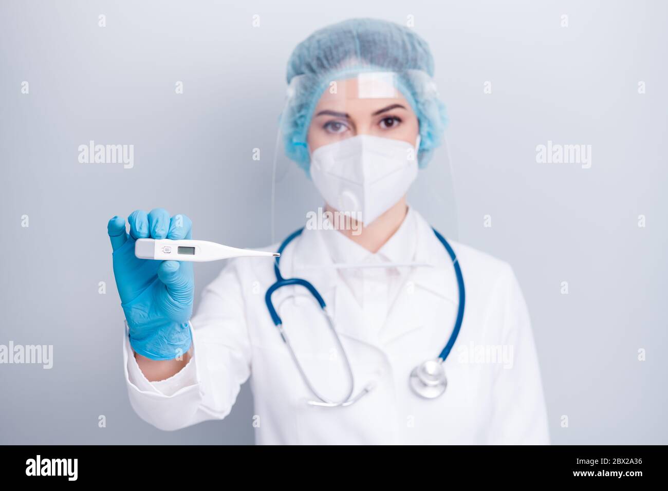 Closeup photo of infection disease virologist doctor hold thermometer ...