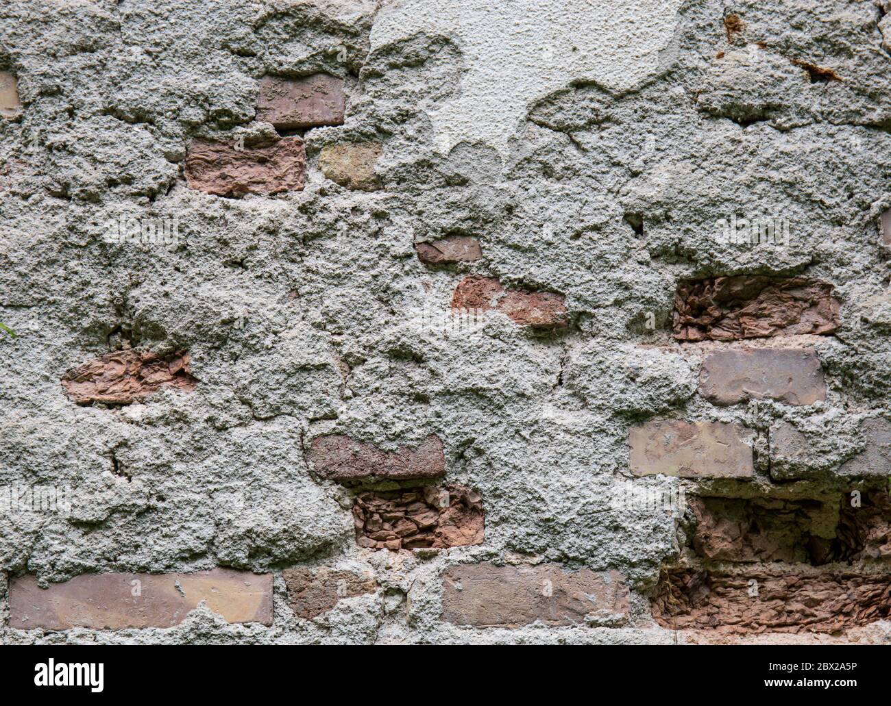 Damaged wall background. The war destroyed part of the house. Damaged ...