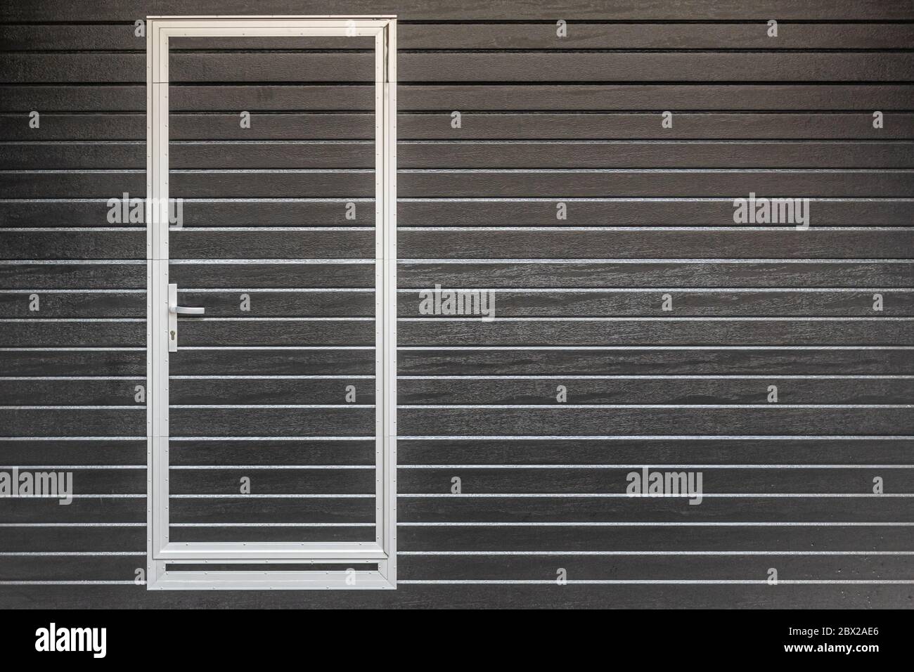 closed brown roller shutter door, gates to the garage. security in a ...