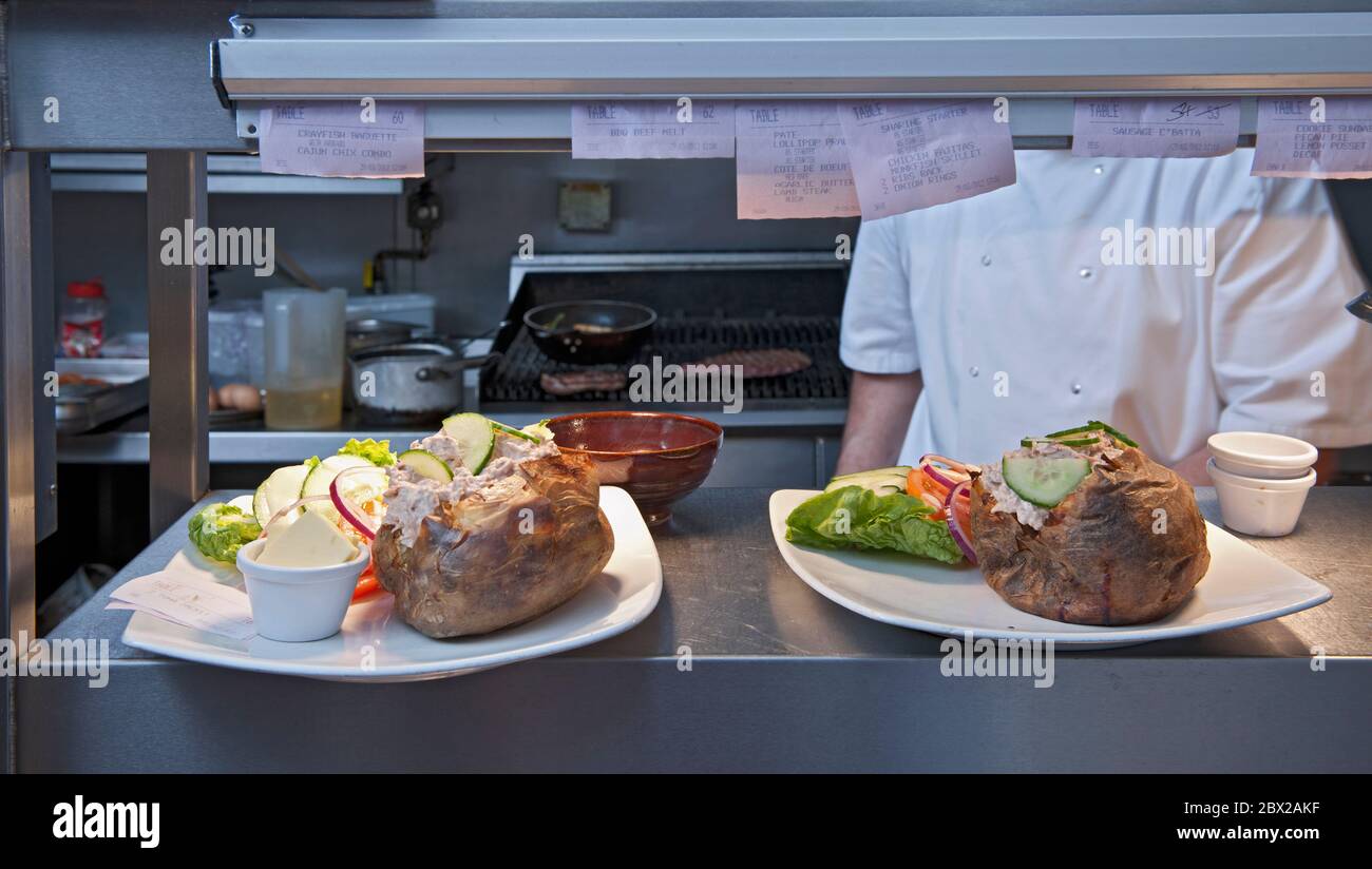 pub food ready to be served in commercial kitchen at British pub Stock ...