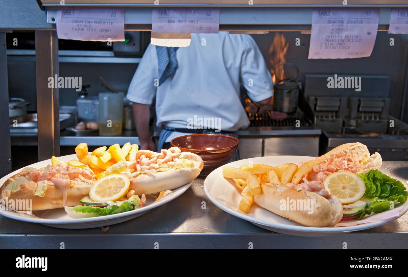 pub food ready to be served in commercial kitchen at British pub Stock ...
