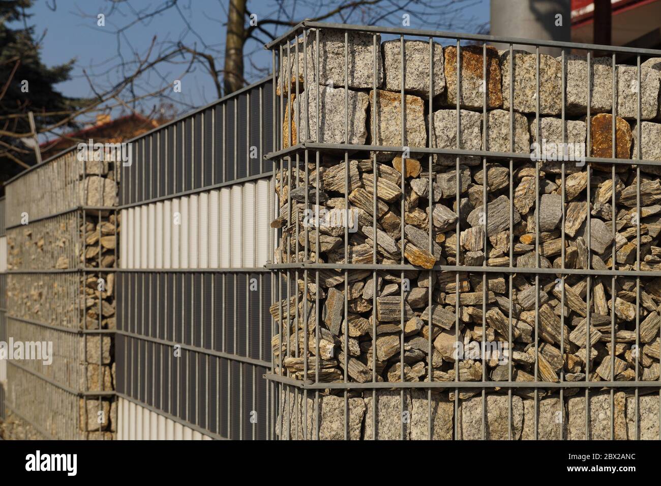 Gabions. An interesting example of fencing, metal baskets filled with ...