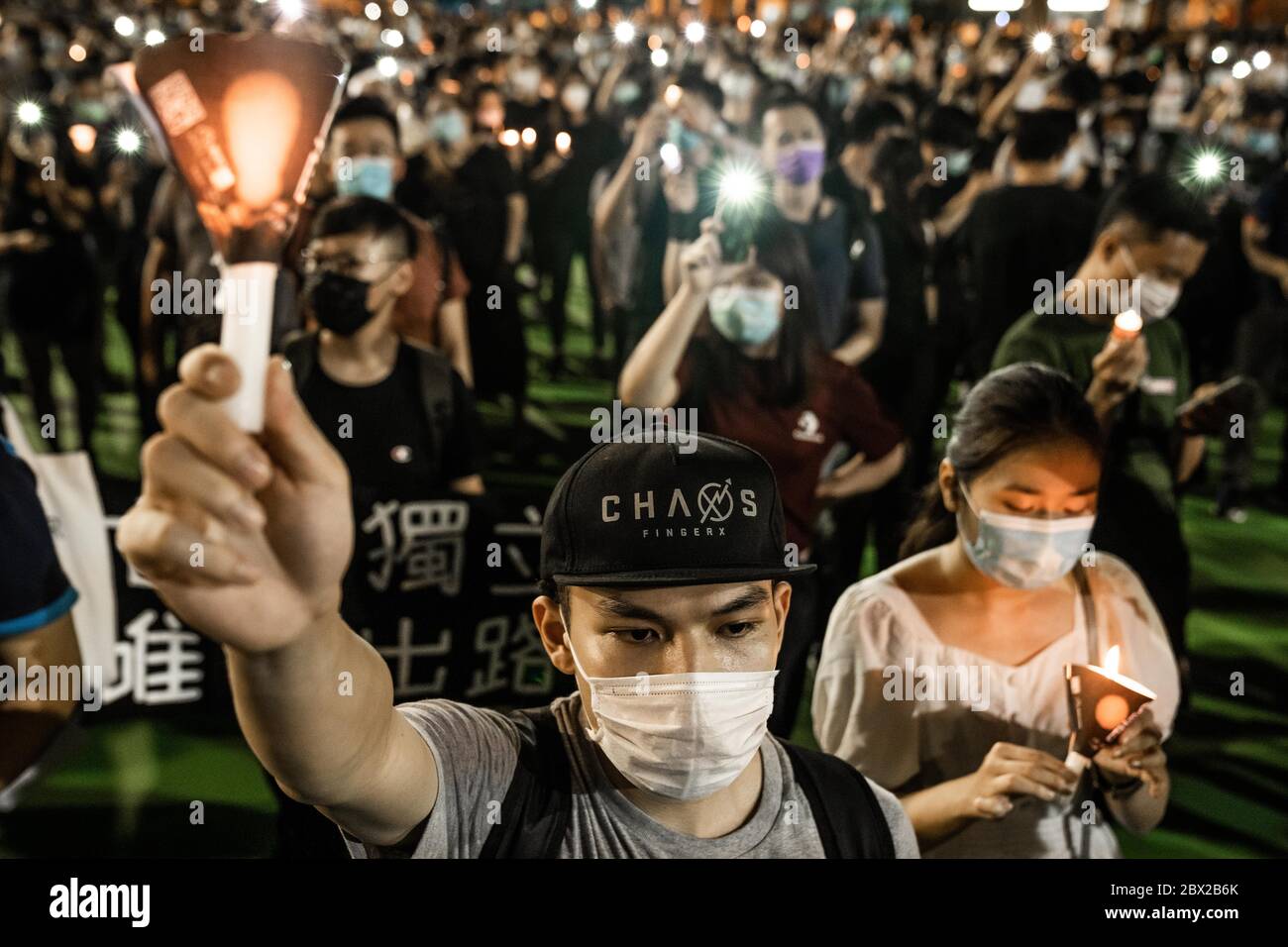 Participants were seen holding up candles which reads "truth" on them ...