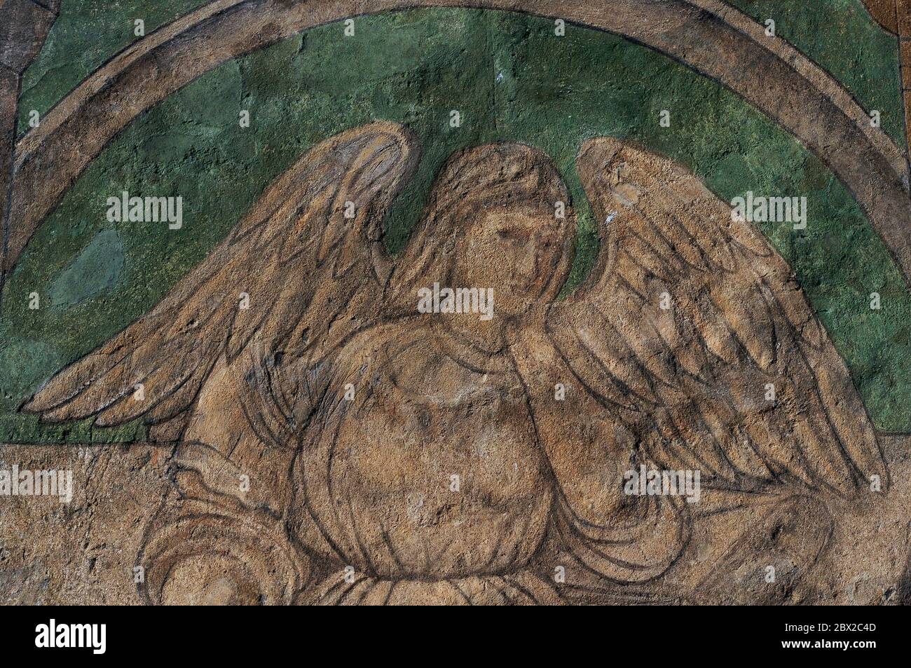 This pensive angel seems deep in thought as she sits, head resting on ...