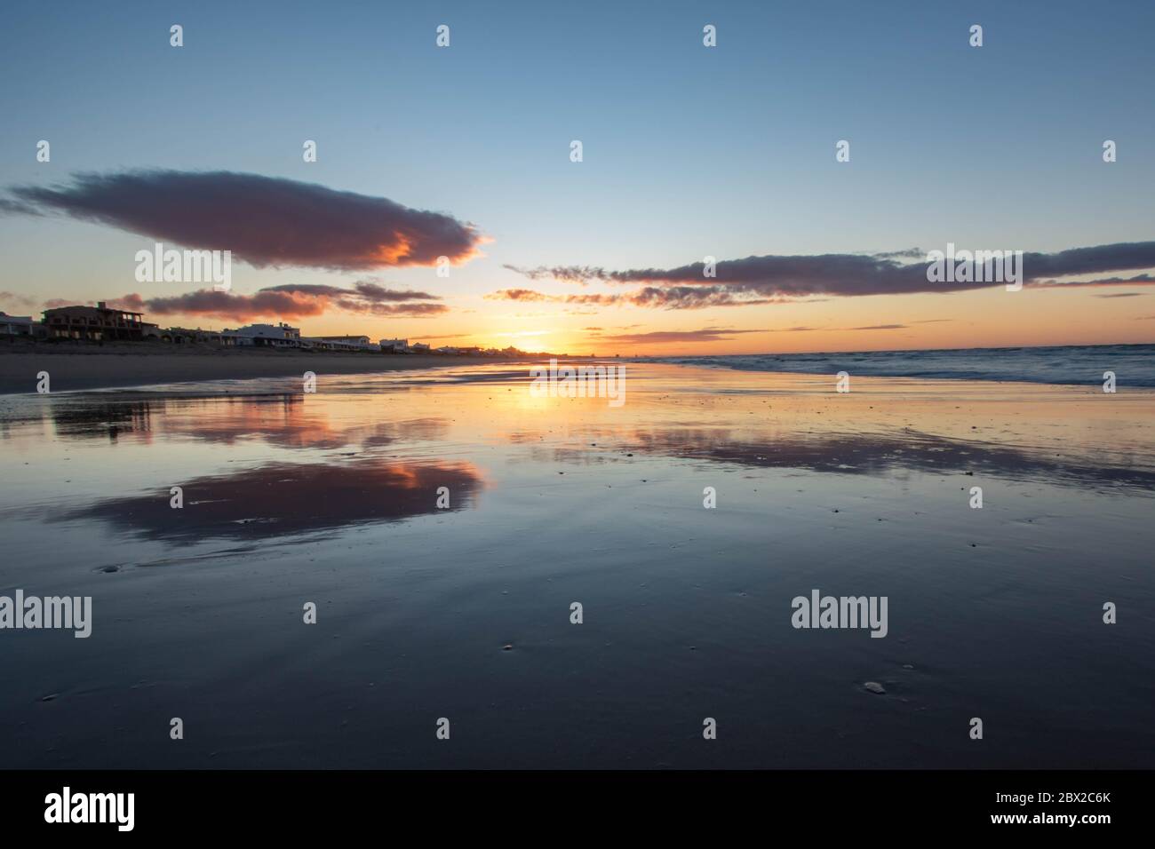 Sunrise Reflection over Mexico Beach Stock Photo - Alamy