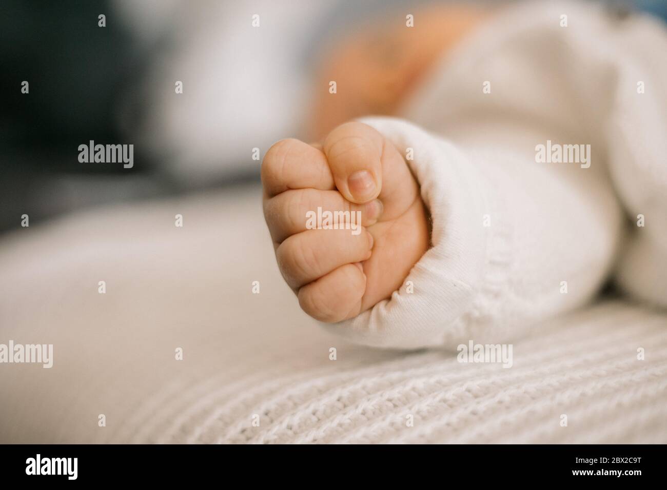 Close up of baby's hand in a fist Stock Photo - Alamy