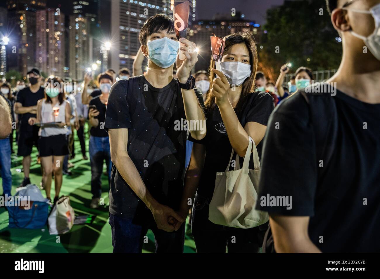 A young couple were seen holding up candles while holding hands in the ...