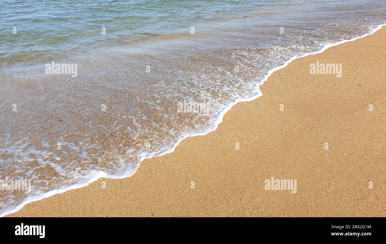 Waves on beach Stock Photo - Alamy