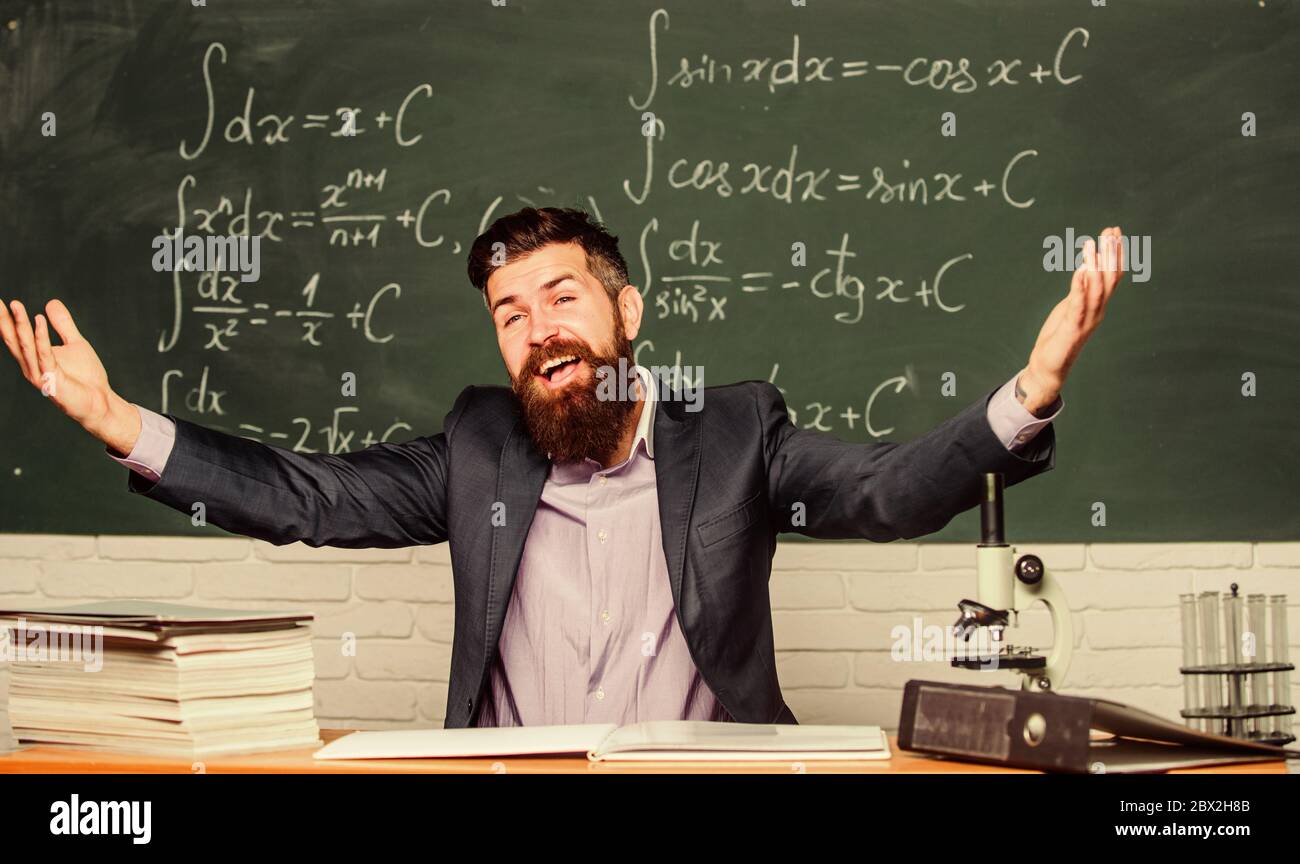Happy welcome back to school. Happy teacher in school. Bearded man ...