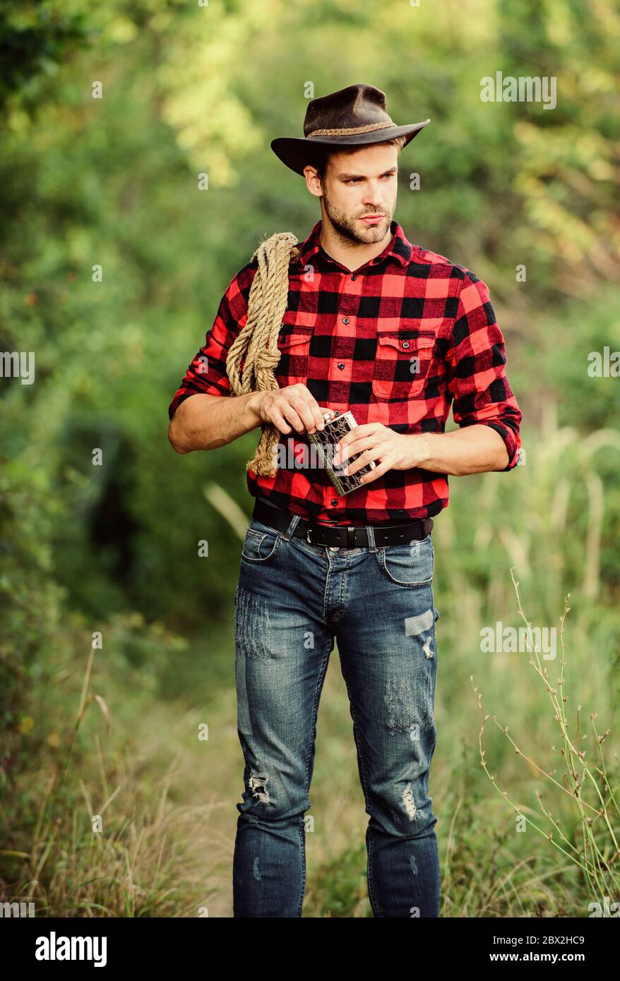 wild wild west. wild west rodeo. man in hat drink whiskey. western ...