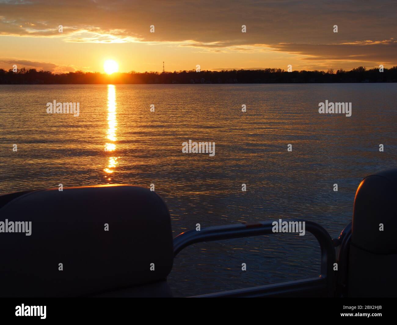Lake Sunset Reflecting on Pontoon Boat Stock Photo - Alamy