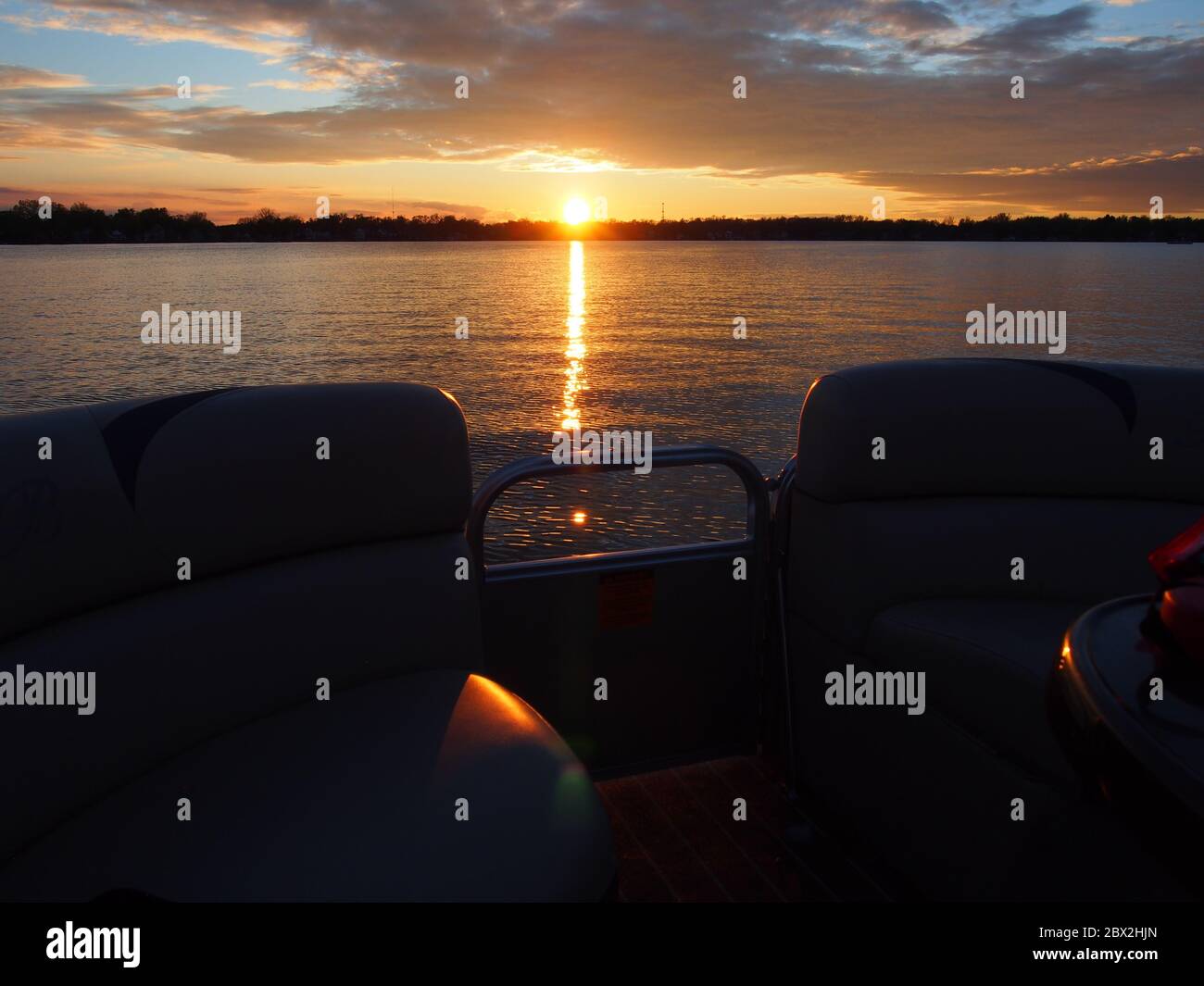 Lake Sunset Reflecting on Pontoon Boat Stock Photo - Alamy