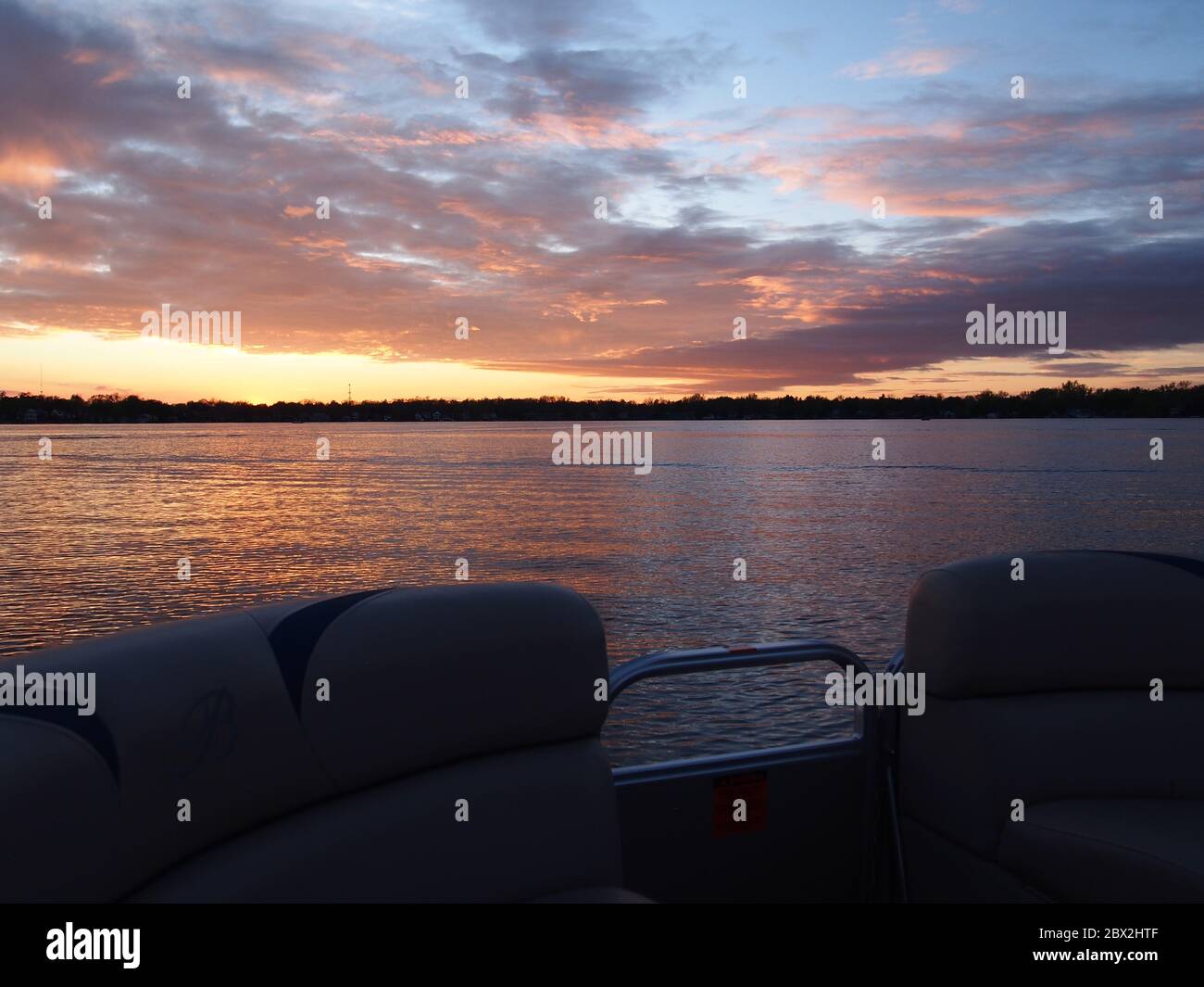 Lake Sunset Reflecting on Pontoon Boat Stock Photo - Alamy