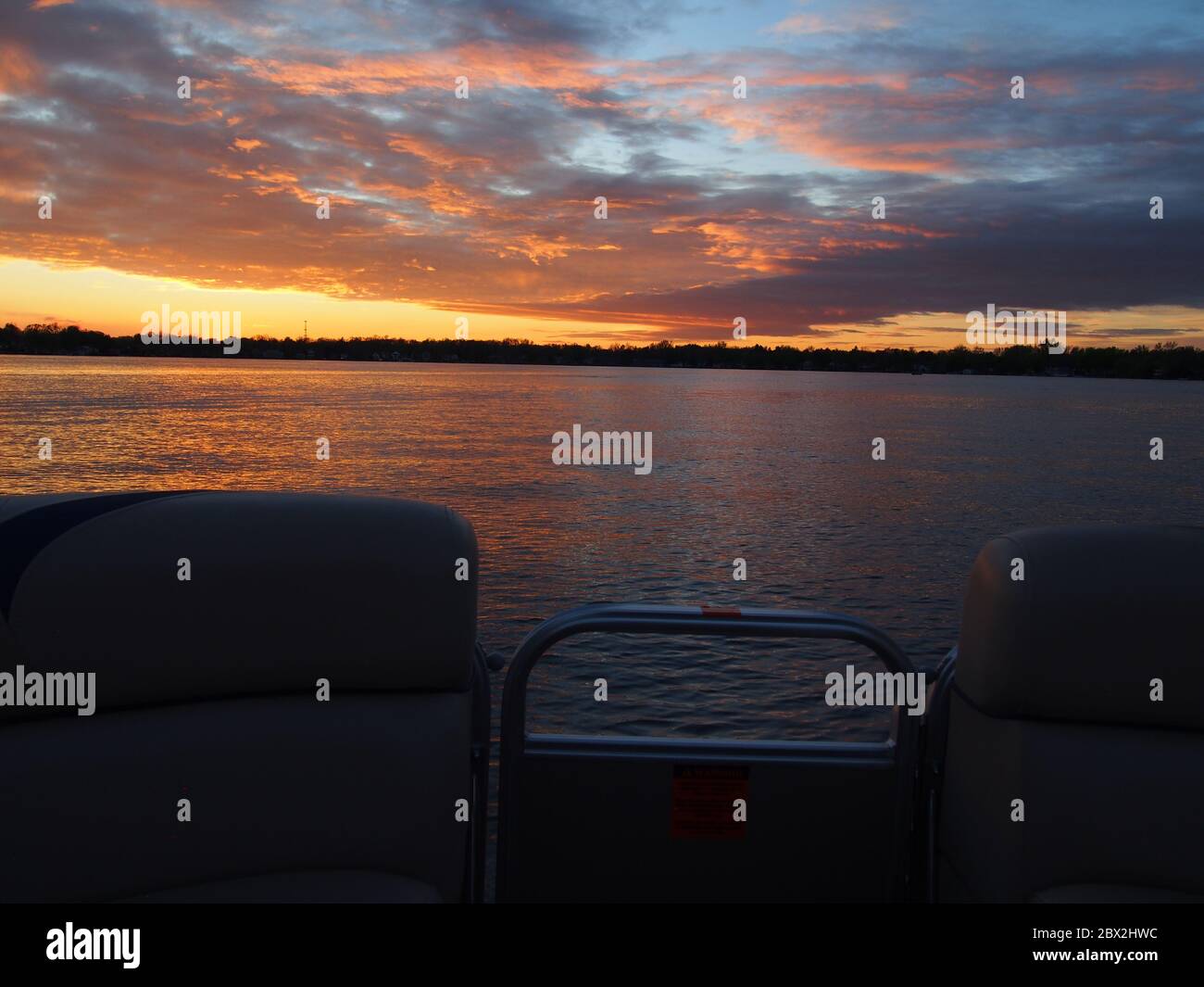 Lake Sunset Reflecting on Pontoon Boat Stock Photo - Alamy