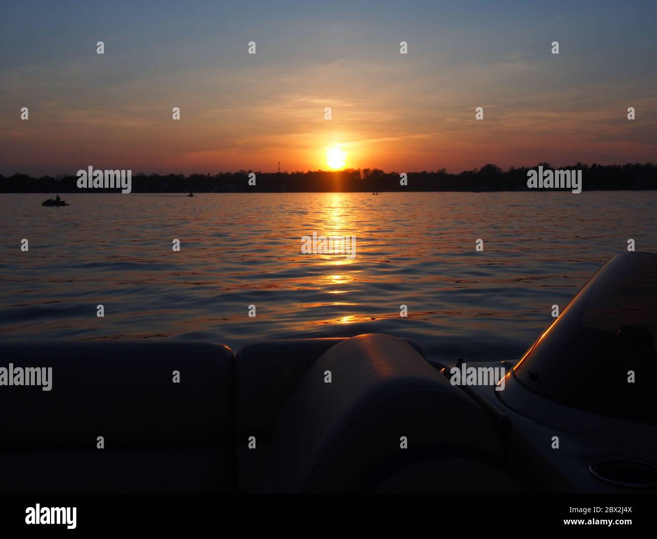 Lake Sunset Reflecting on Pontoon Boat Stock Photo - Alamy