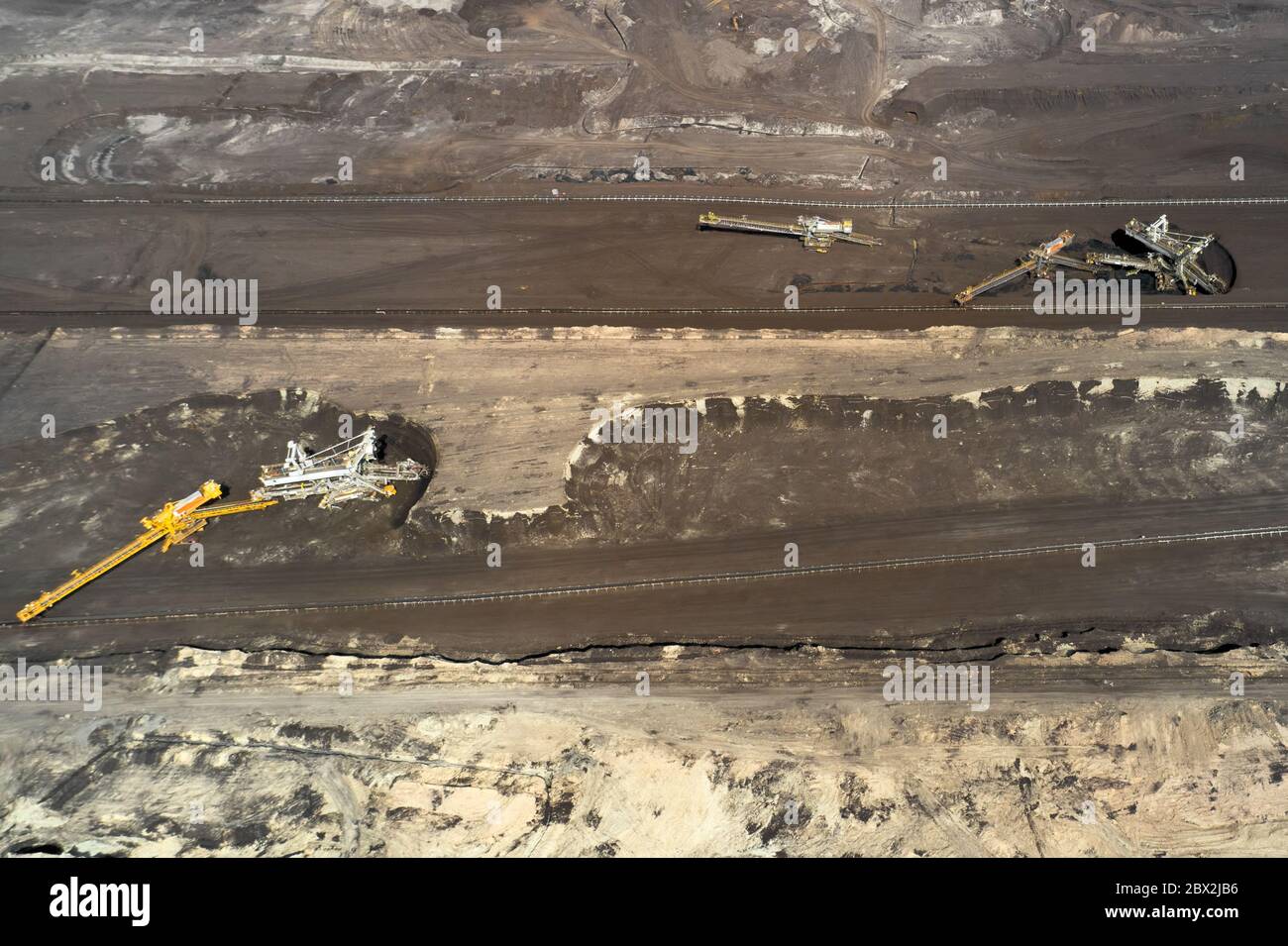 Aerial shoot of quarry with heavy bucket wheel excavators mining a coal ...