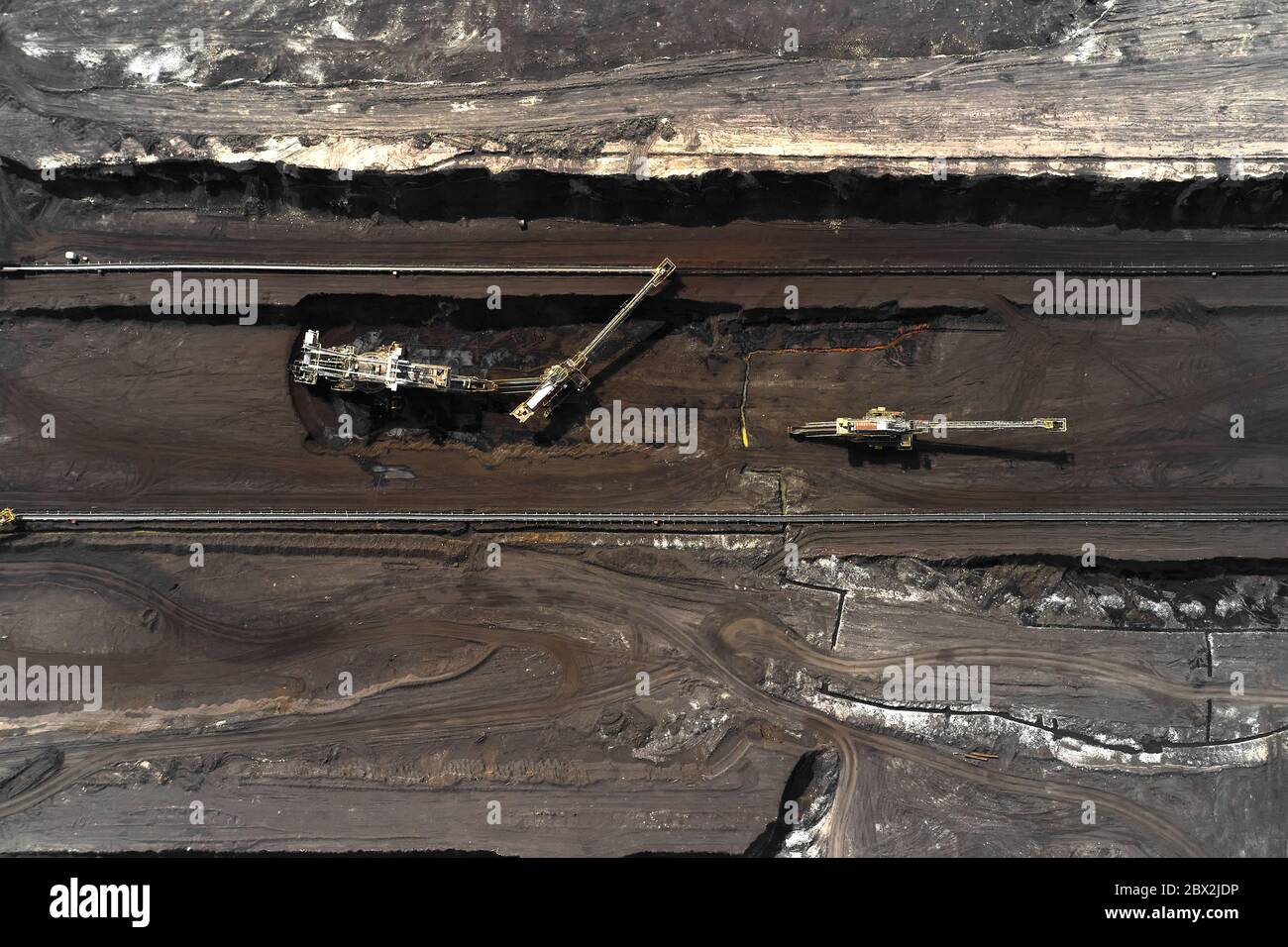 Aerial shoot of quarry with heavy bucket wheel excavators mining a coal ...