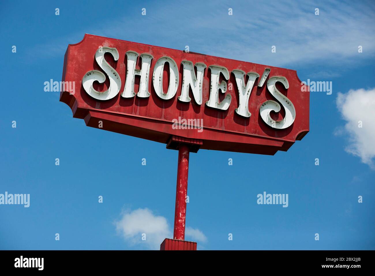 A logo sign outside of a Shoney's restaurant location in Sutton, West ...