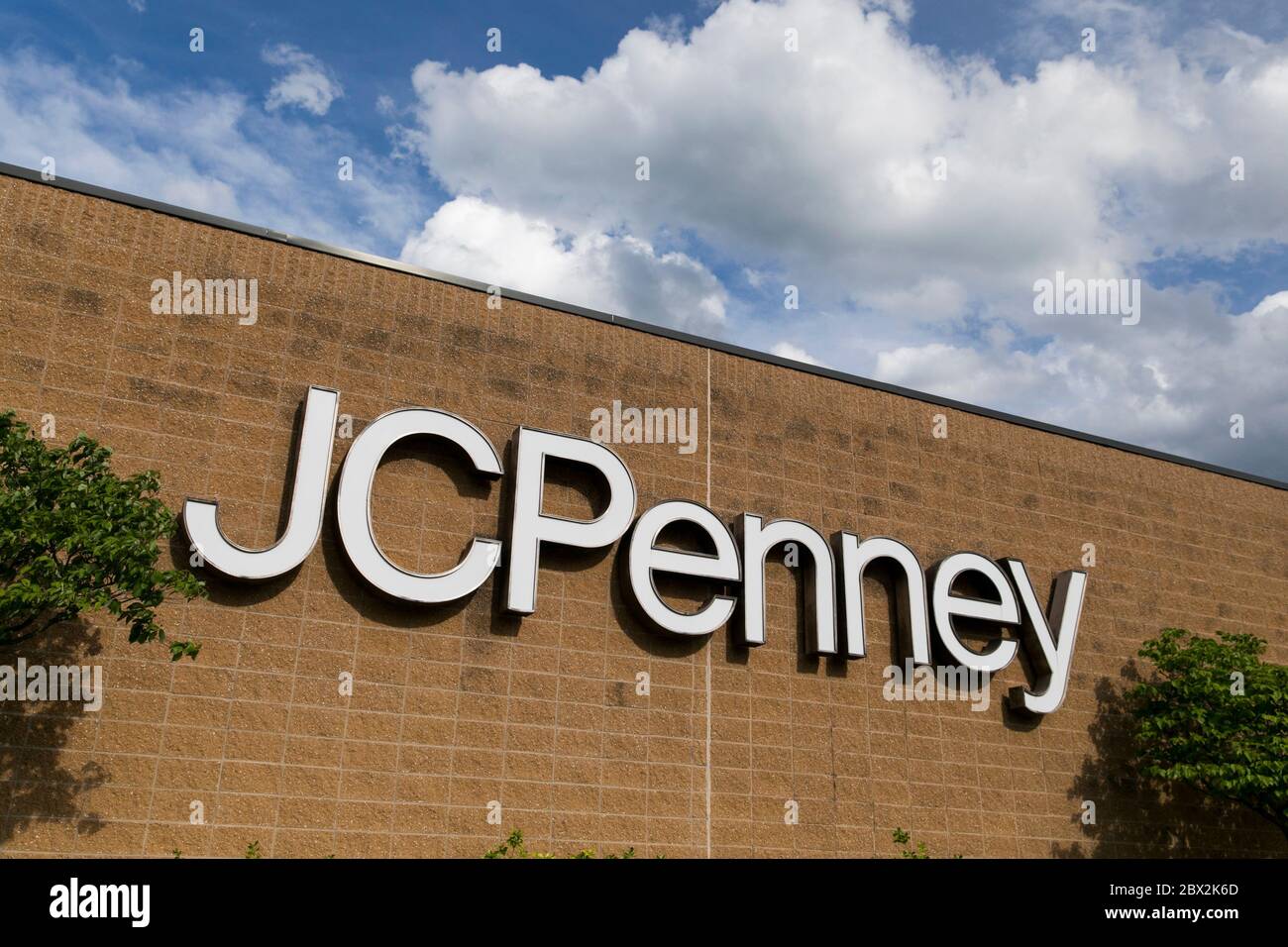 A logo sign outside of a JCPenney retail store location in Cumberland ...