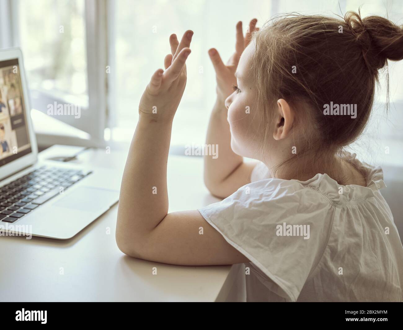 Cute little girl using laptop at home. Education, online study, home ...