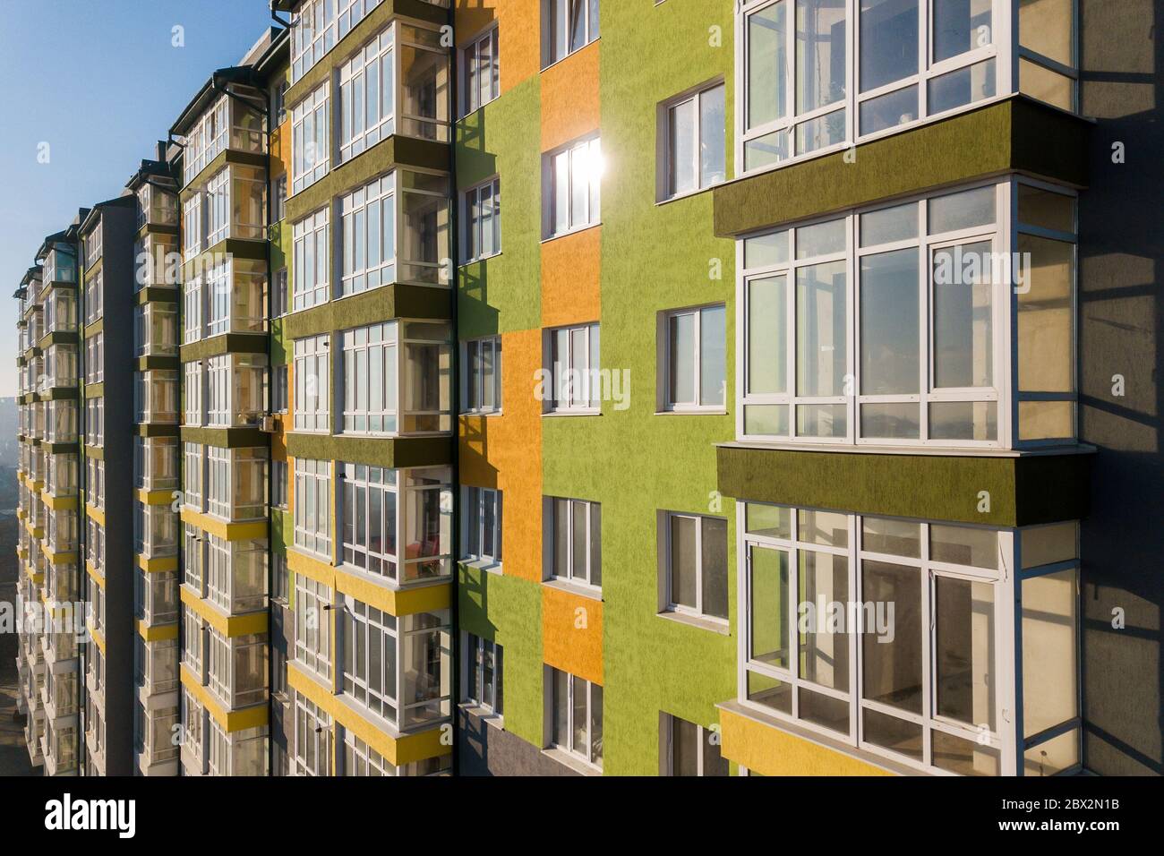 Aerial view of a tall residential apartment building with many windows ...