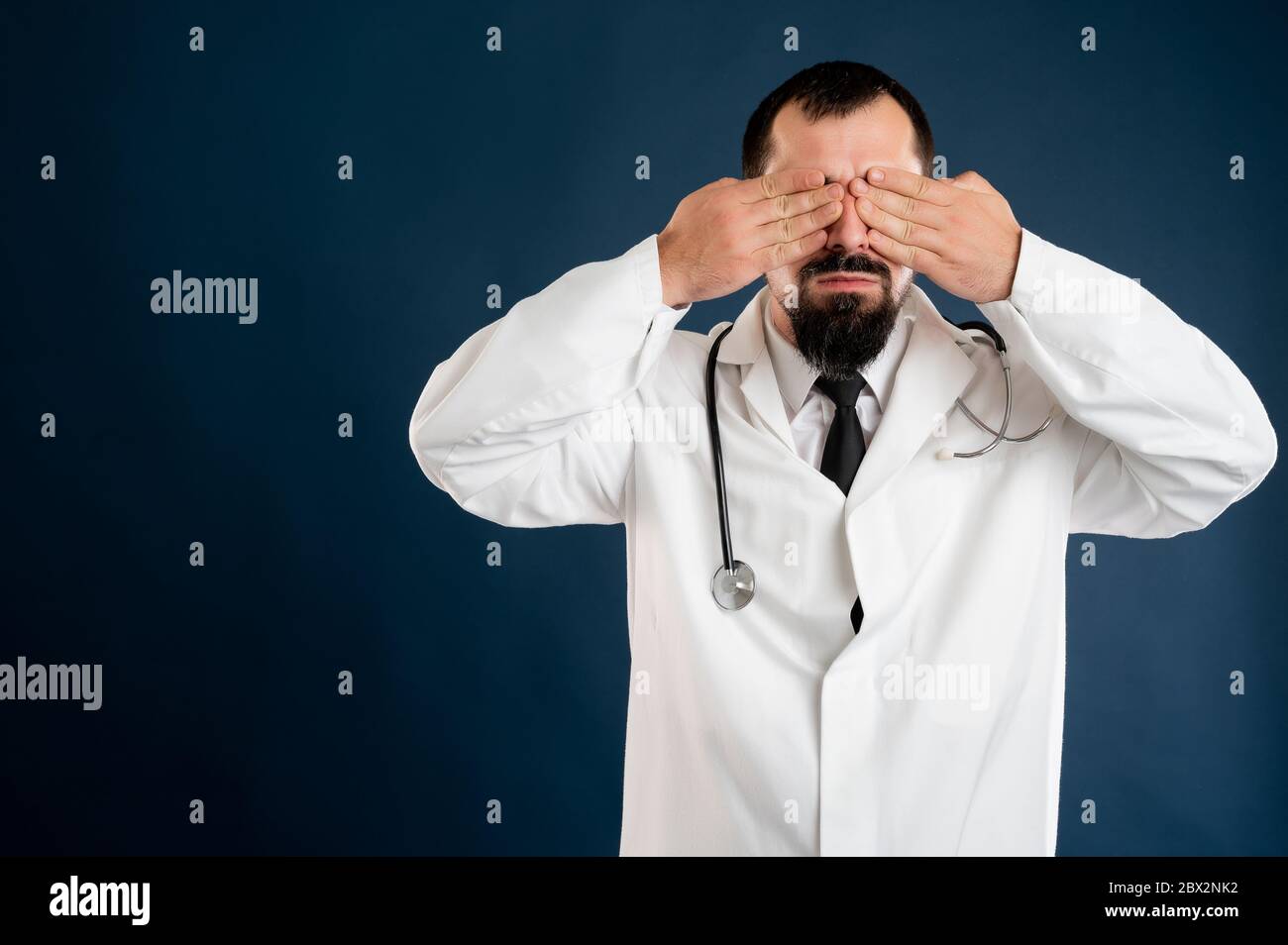 Portrait of male doctor with stethoscope in medical uniform covering ...