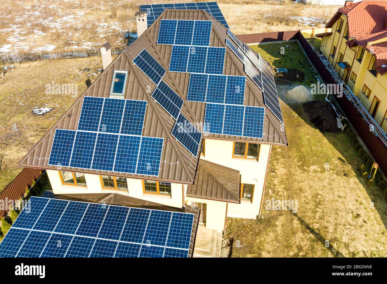 Aerial top view of new modern residential house cottage with blue shiny ...