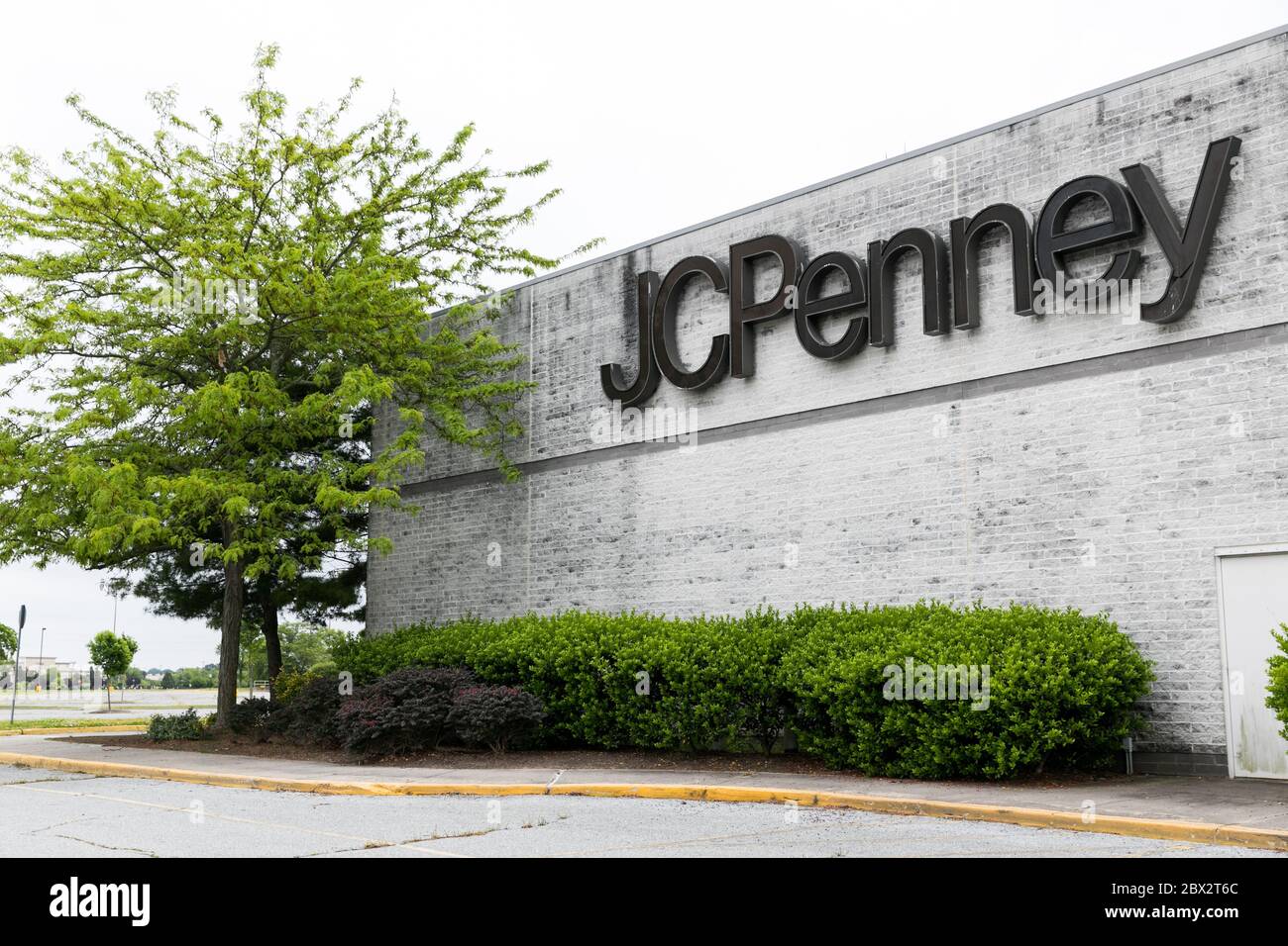 A logo sign outside of a JCPenney retail store location in Dover ...