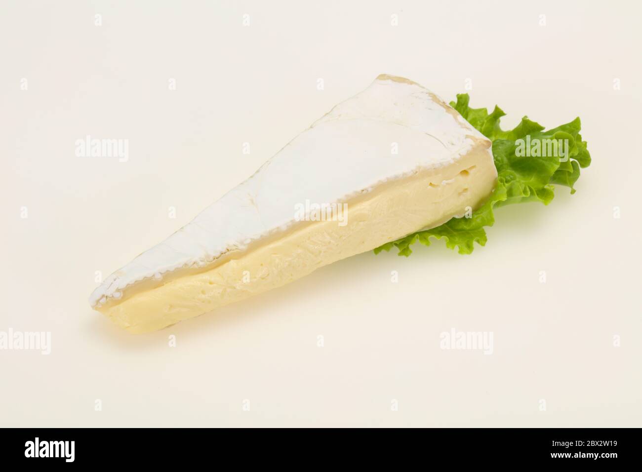 Brie cheese triangle served salad leaves Stock Photo - Alamy