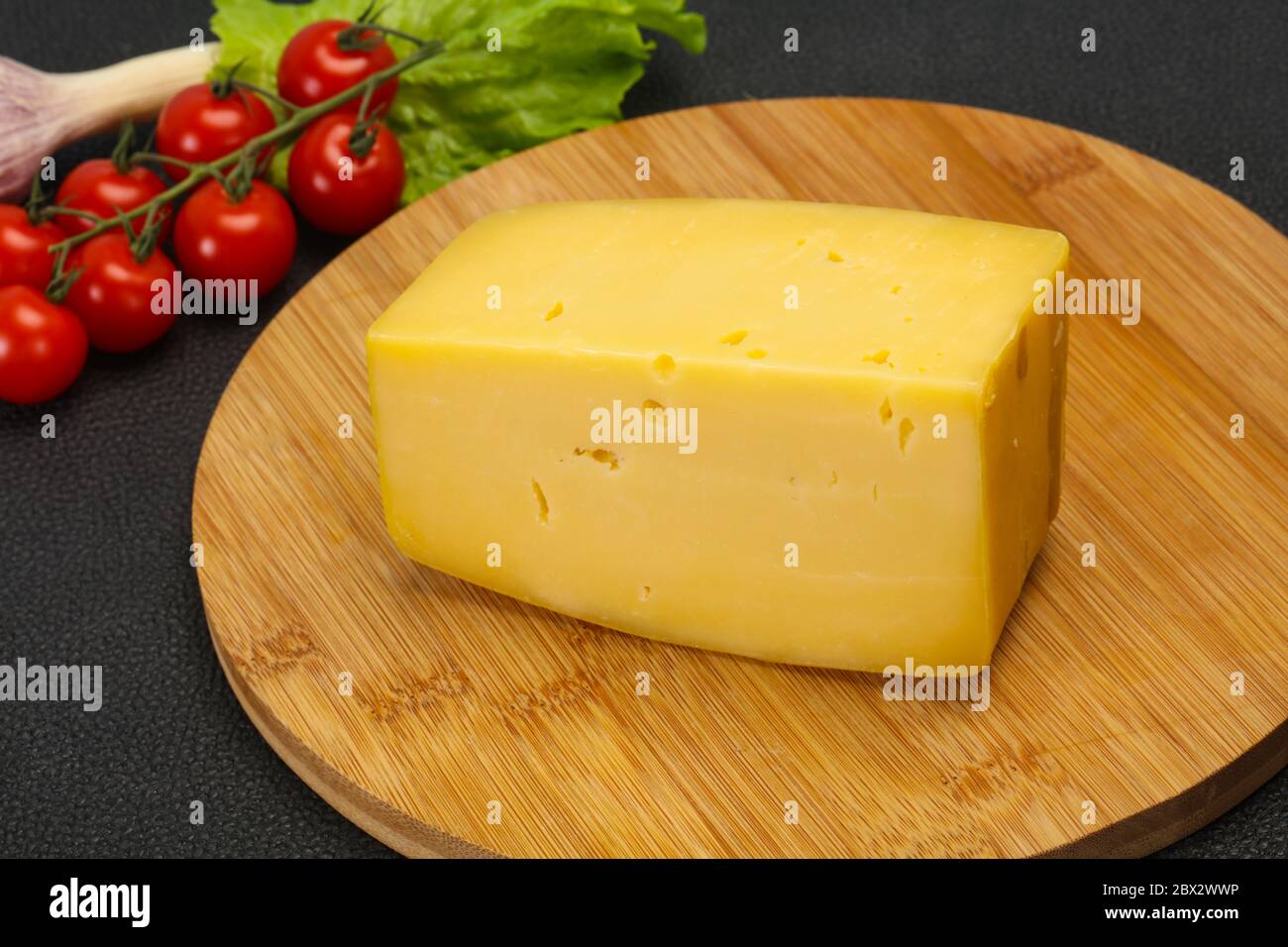 Swiss Hard yellow tasty cheese brick Stock Photo - Alamy