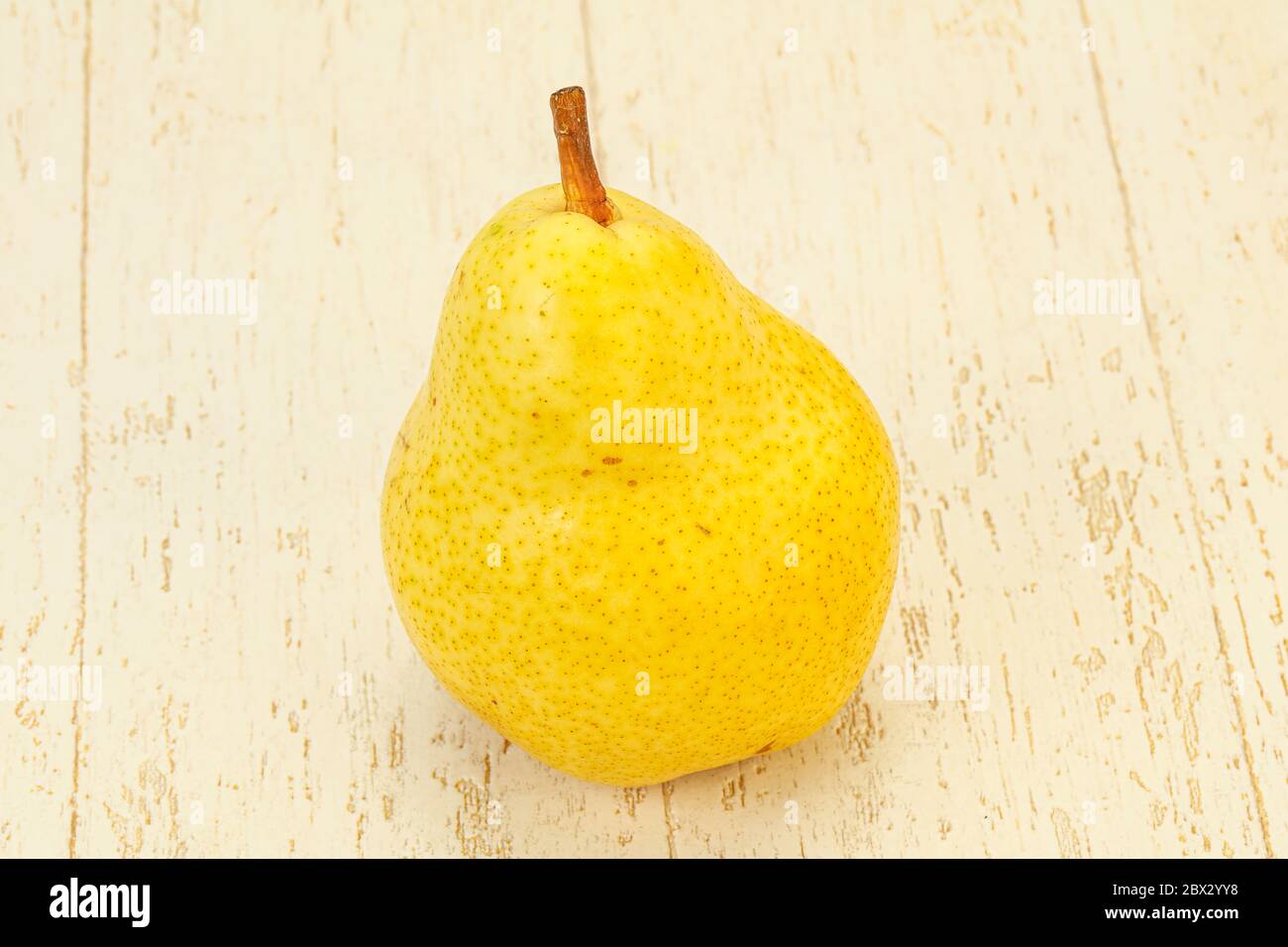 Fresh sweet yellow pear over background Stock Photo - Alamy