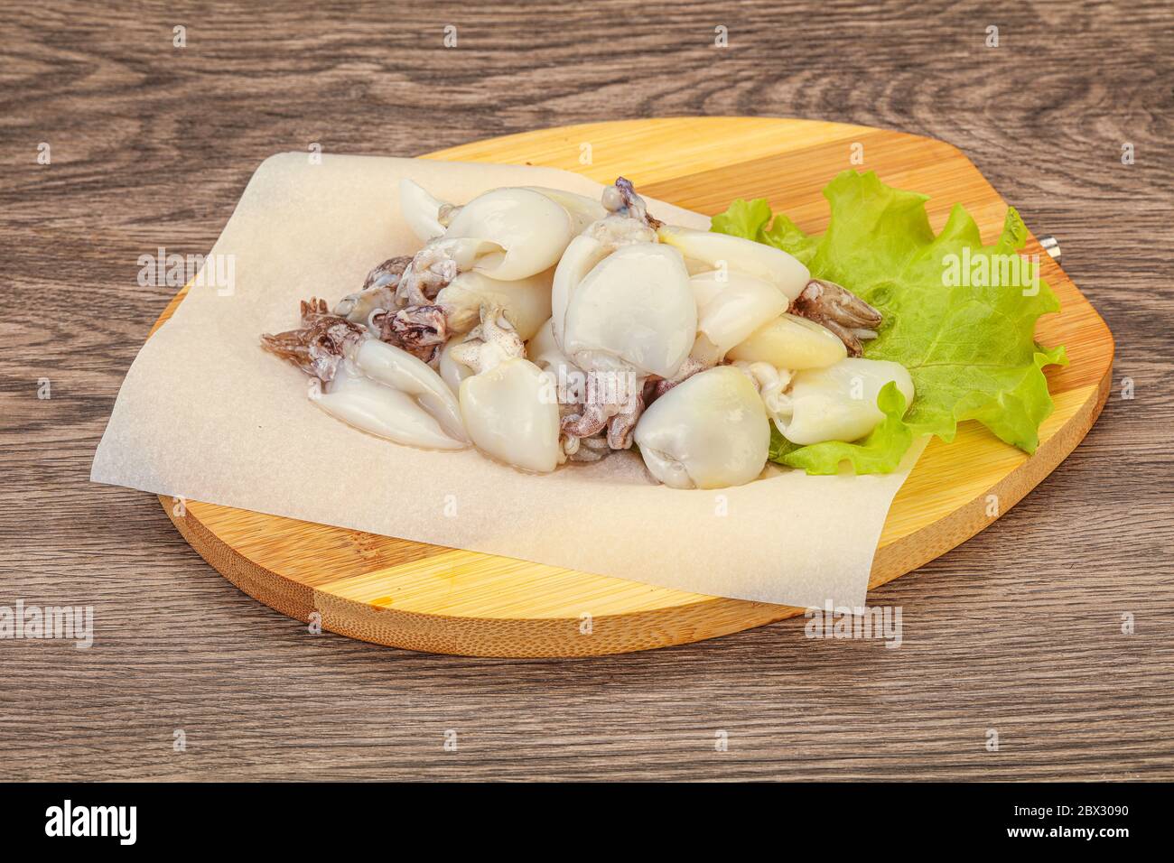 Raw seafood - cuttlefish for cooking over board Stock Photo - Alamy