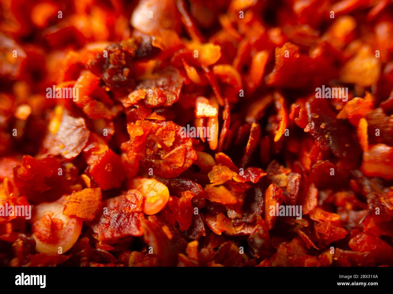 Red powdered pepper background texture close up Stock Photo - Alamy