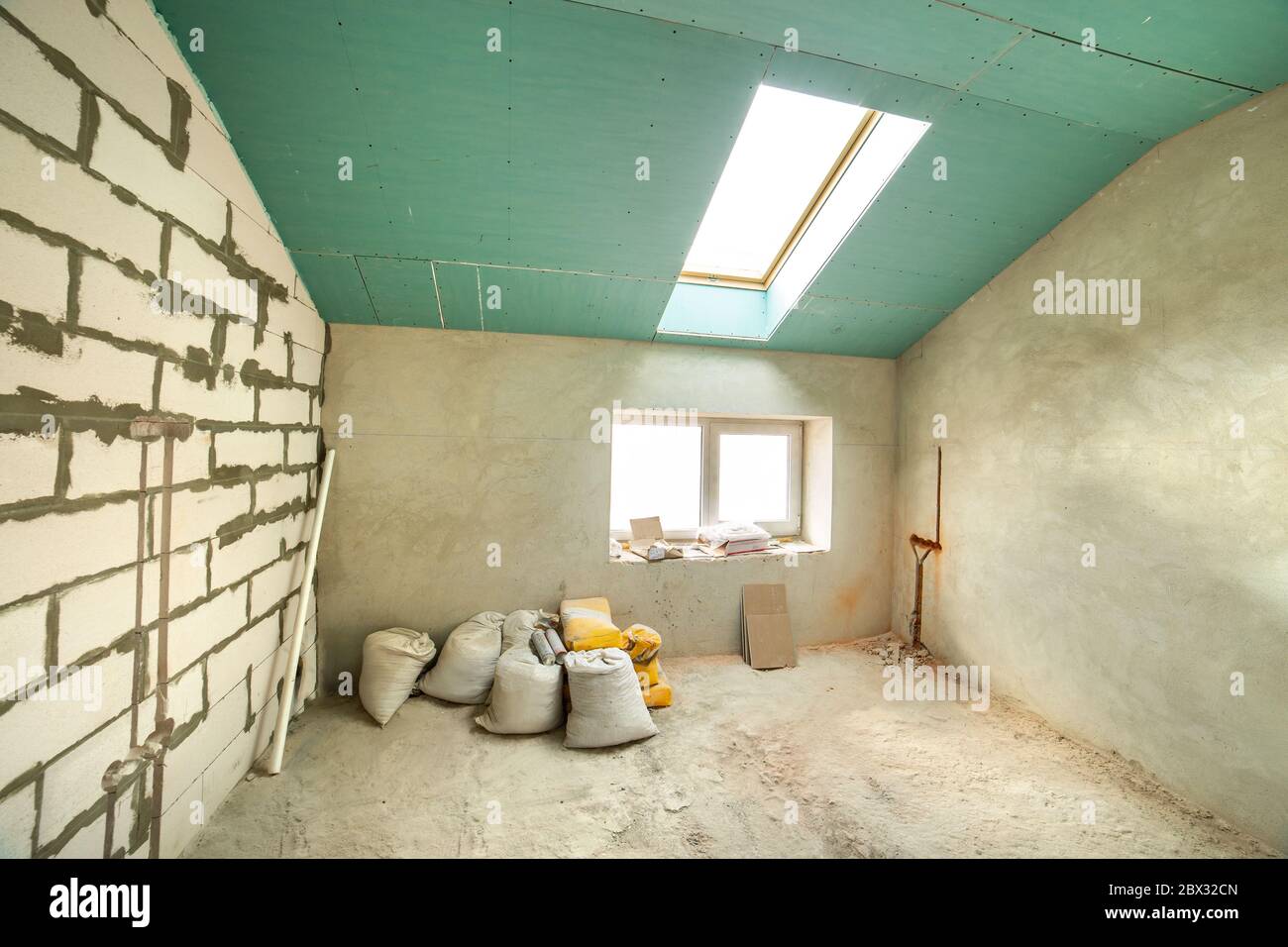 Interior of an apartment room with bare walls and ceiling under ...