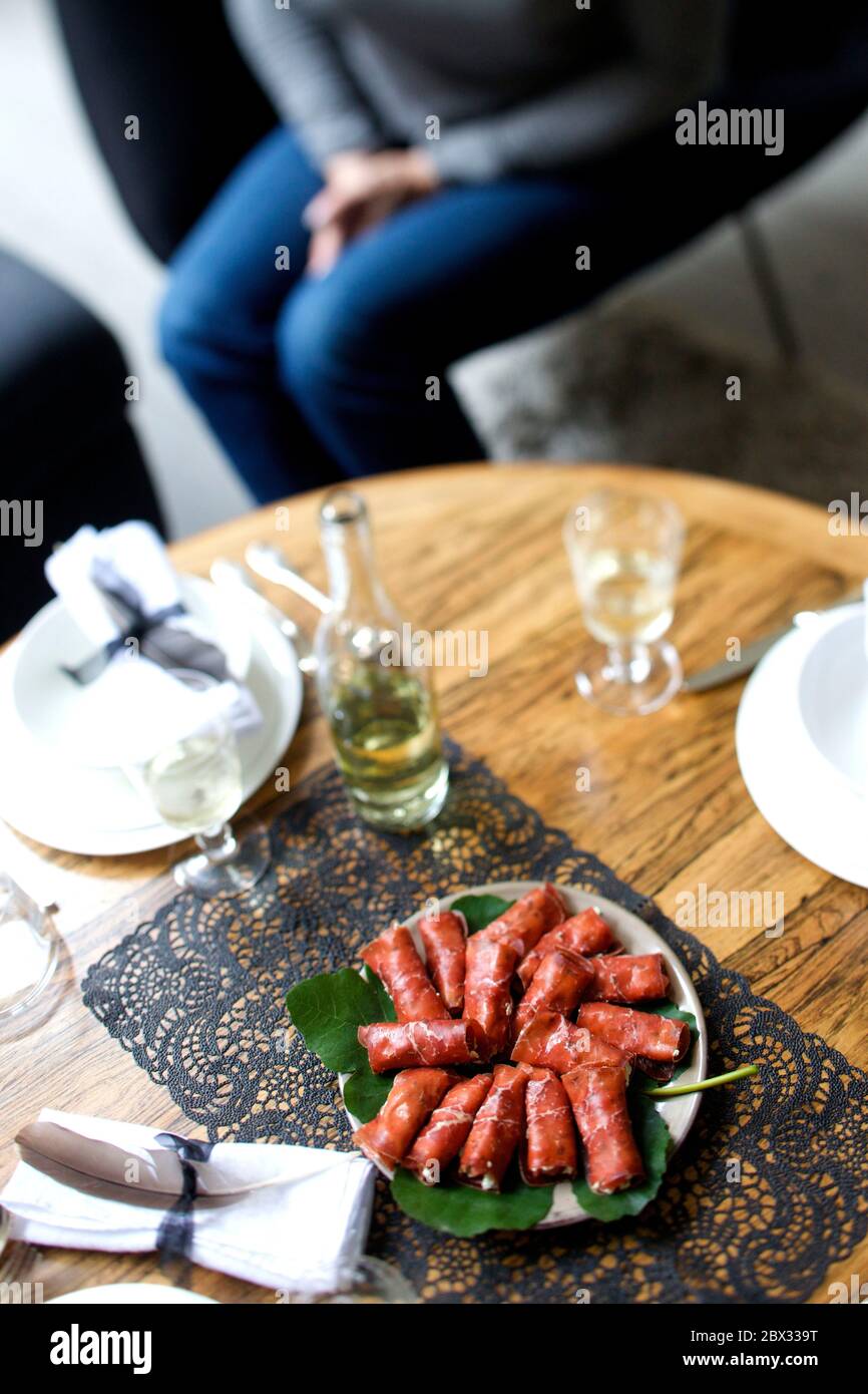 Dinner with a girlfriend roulade with grison meat Stock Photo - Alamy