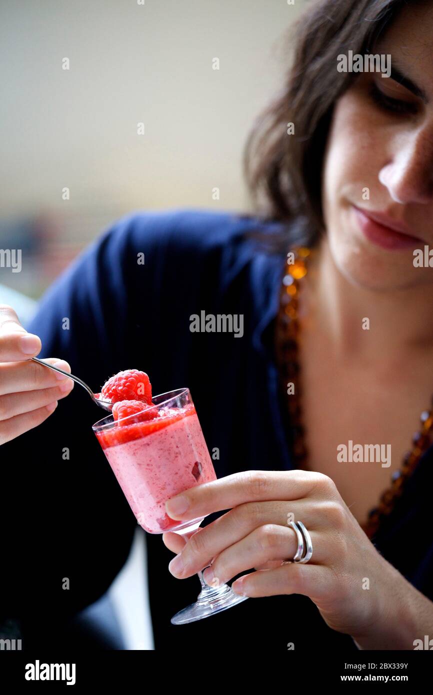 Dinner with girlfriend raspberry dessert Stock Photo - Alamy