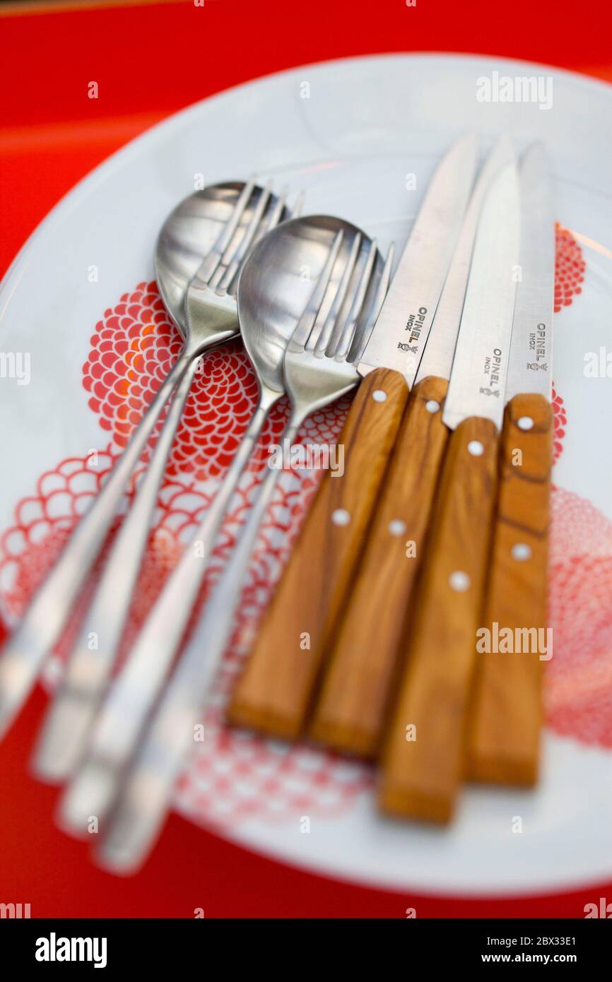 Dinner return from holiday table setting Stock Photo - Alamy