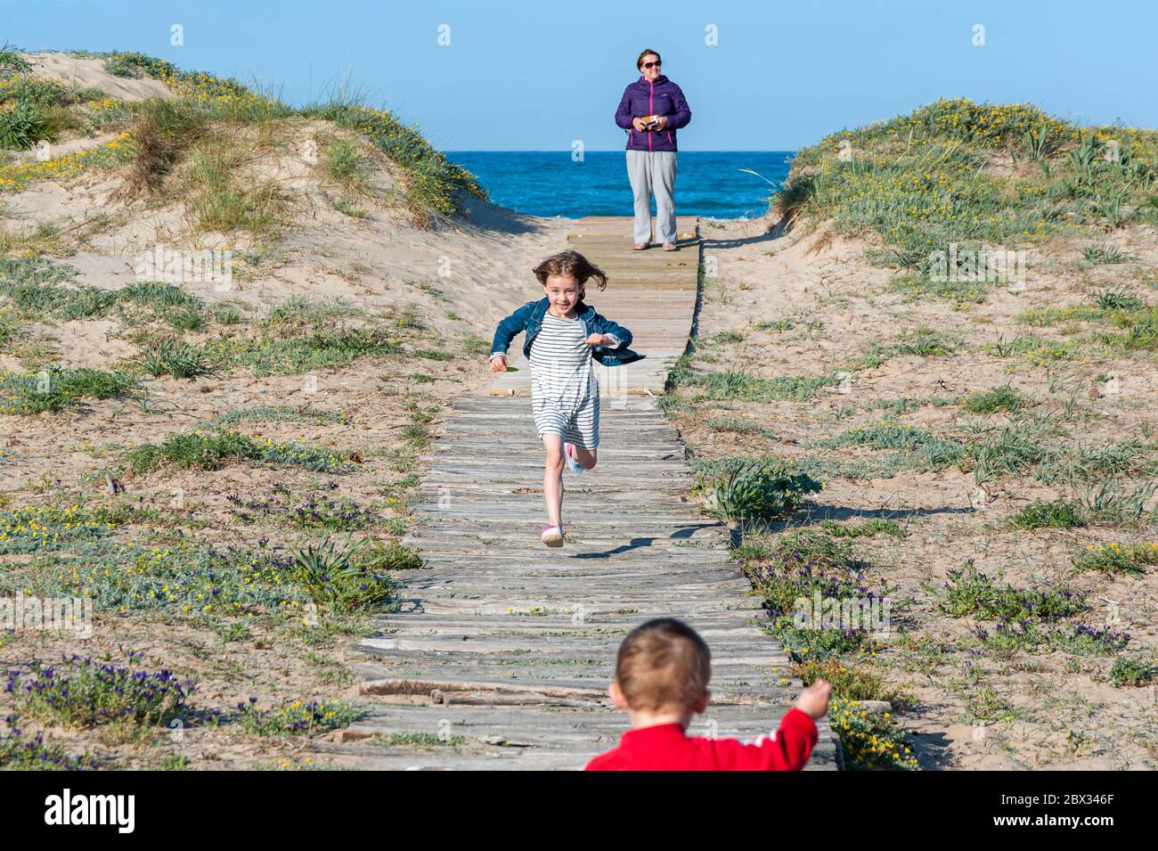Child running on path rear view hi-res stock photography and images - Alamy