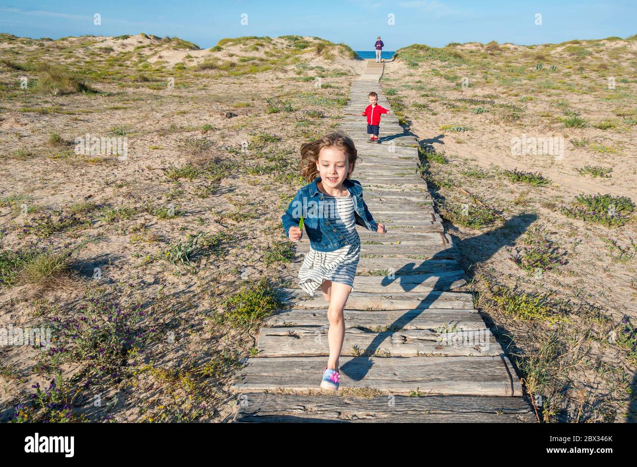 Child running on path rear view hi-res stock photography and images - Alamy