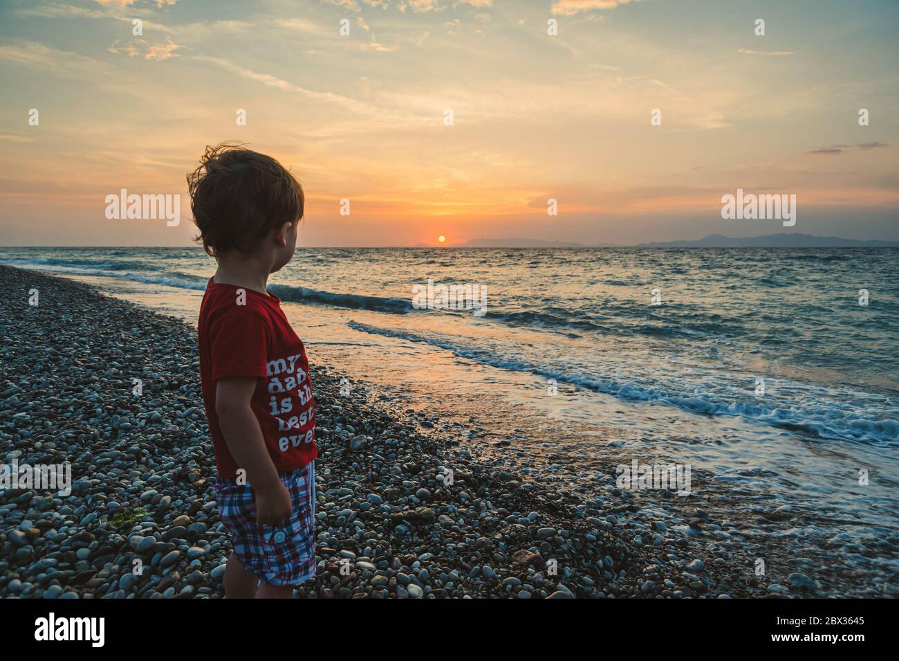 Boy On Pebble Beach High Resolution Stock Photography and Images - Alamy