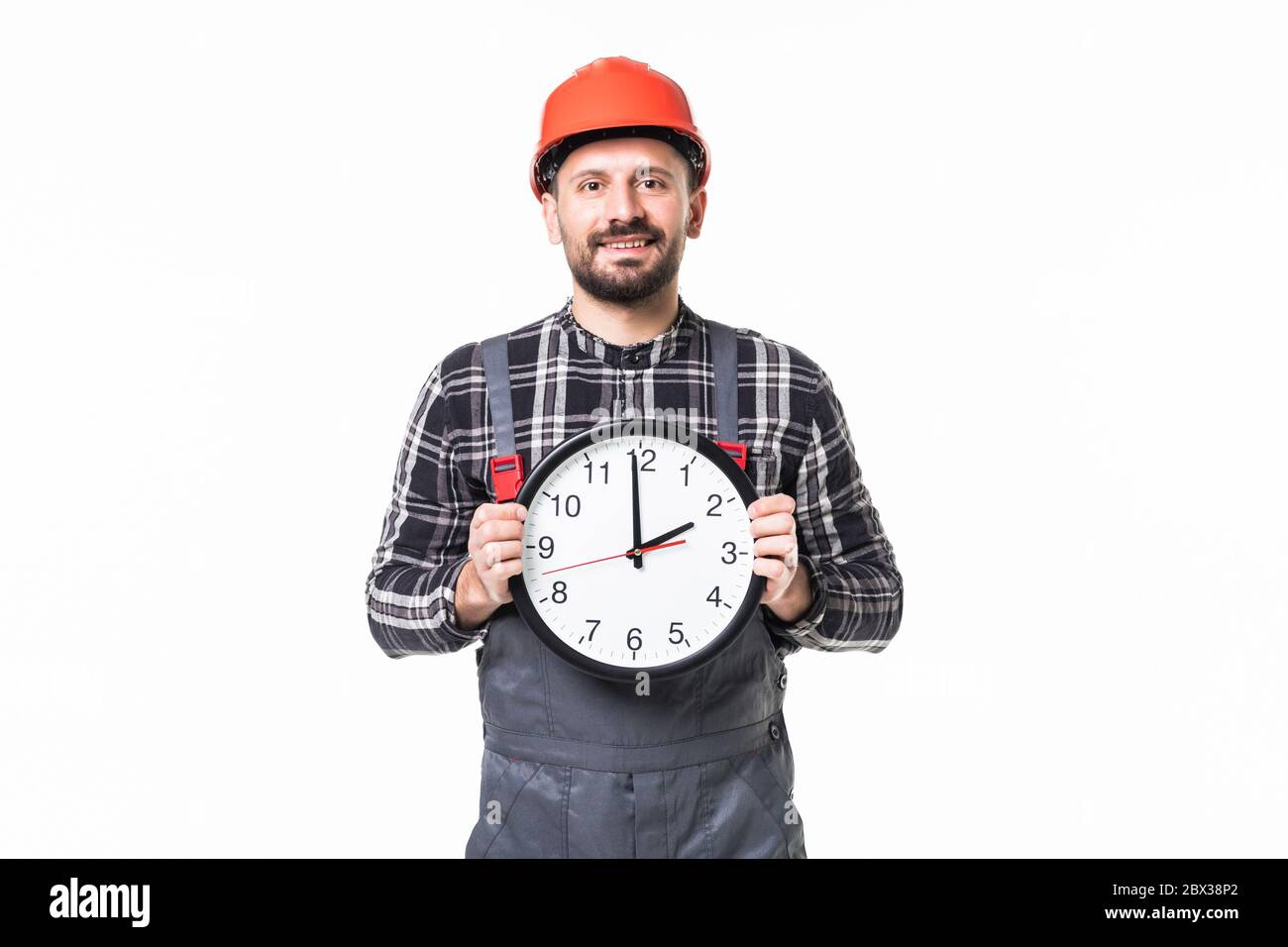 Young repairman with an alarm clock isolated on white background Stock ...
